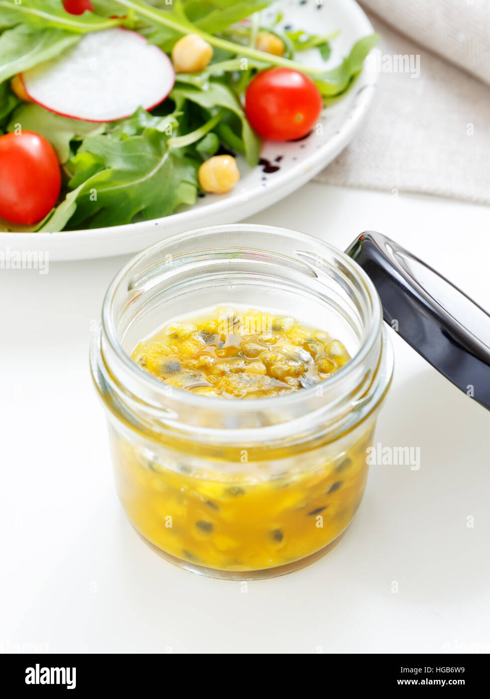 Passion fruit dressing with healthy vegetable salad Stock Photo - Alamy