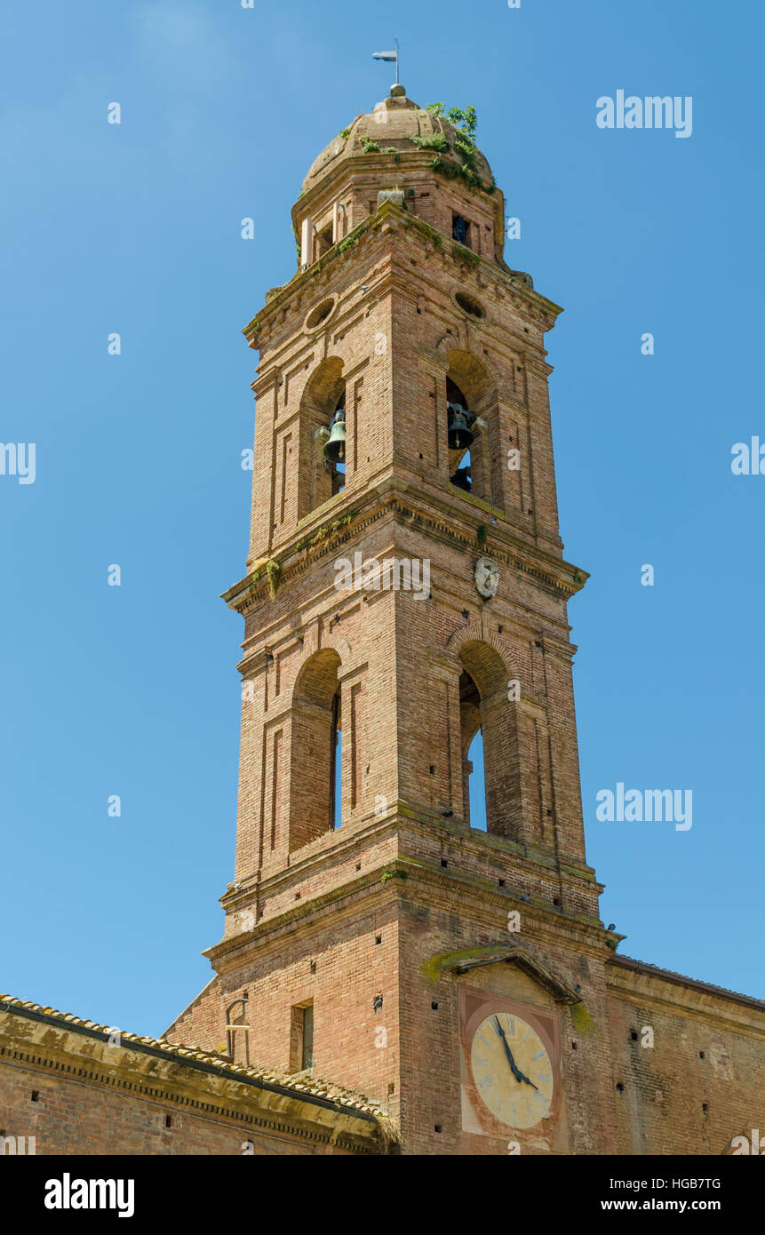 Typical historic Italian church tower with bells and clock in Siena ...