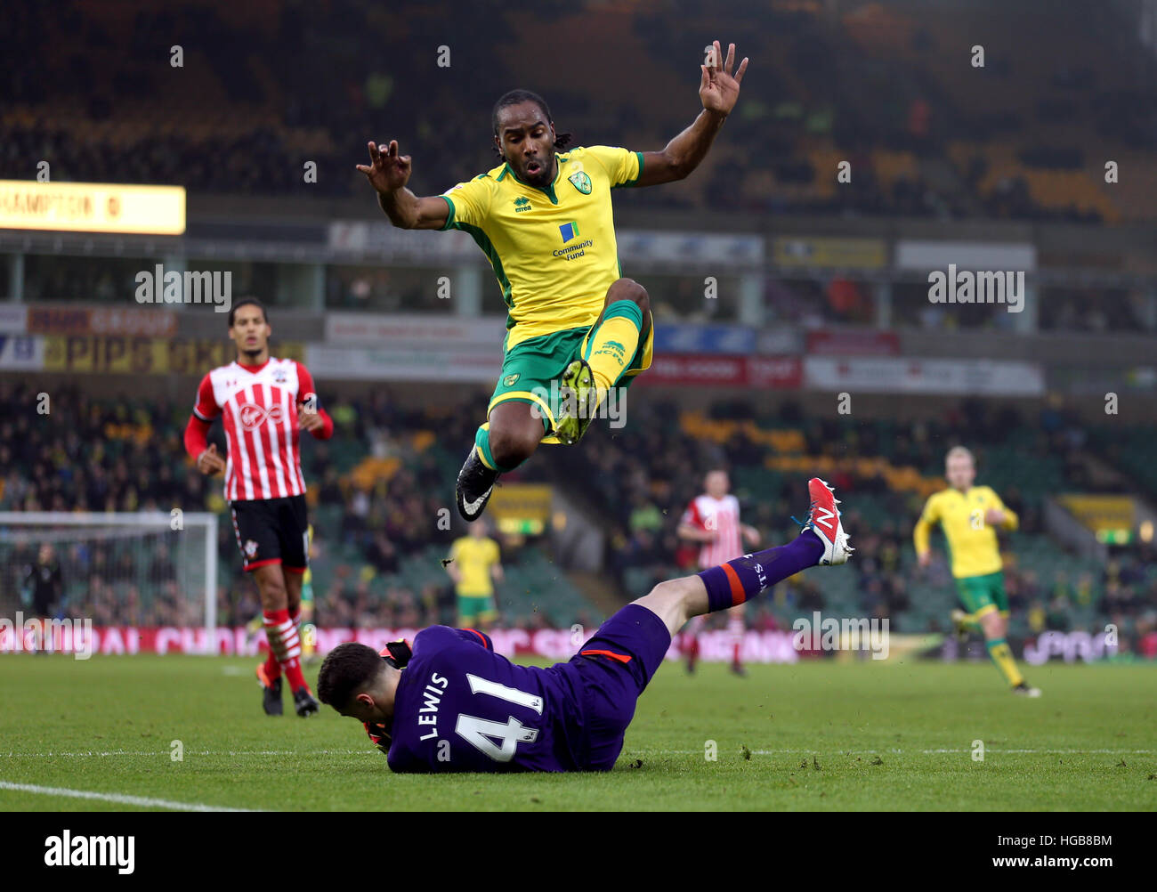 Southampton goalkeeper Harry Lewis saves at the feet of Norwich City's ...