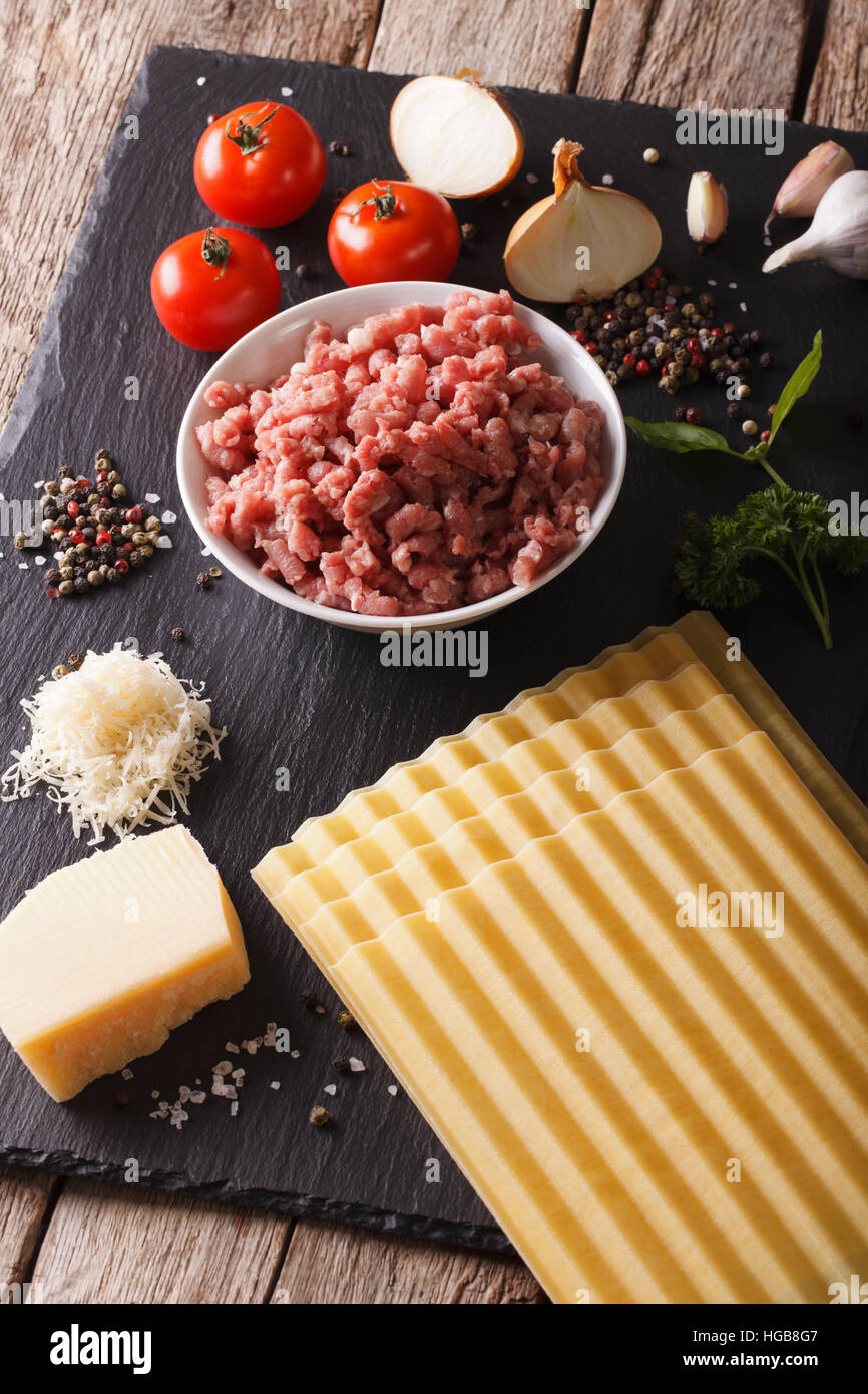 Recipe for classic Italian lasagna close-up on the table. vertical ...