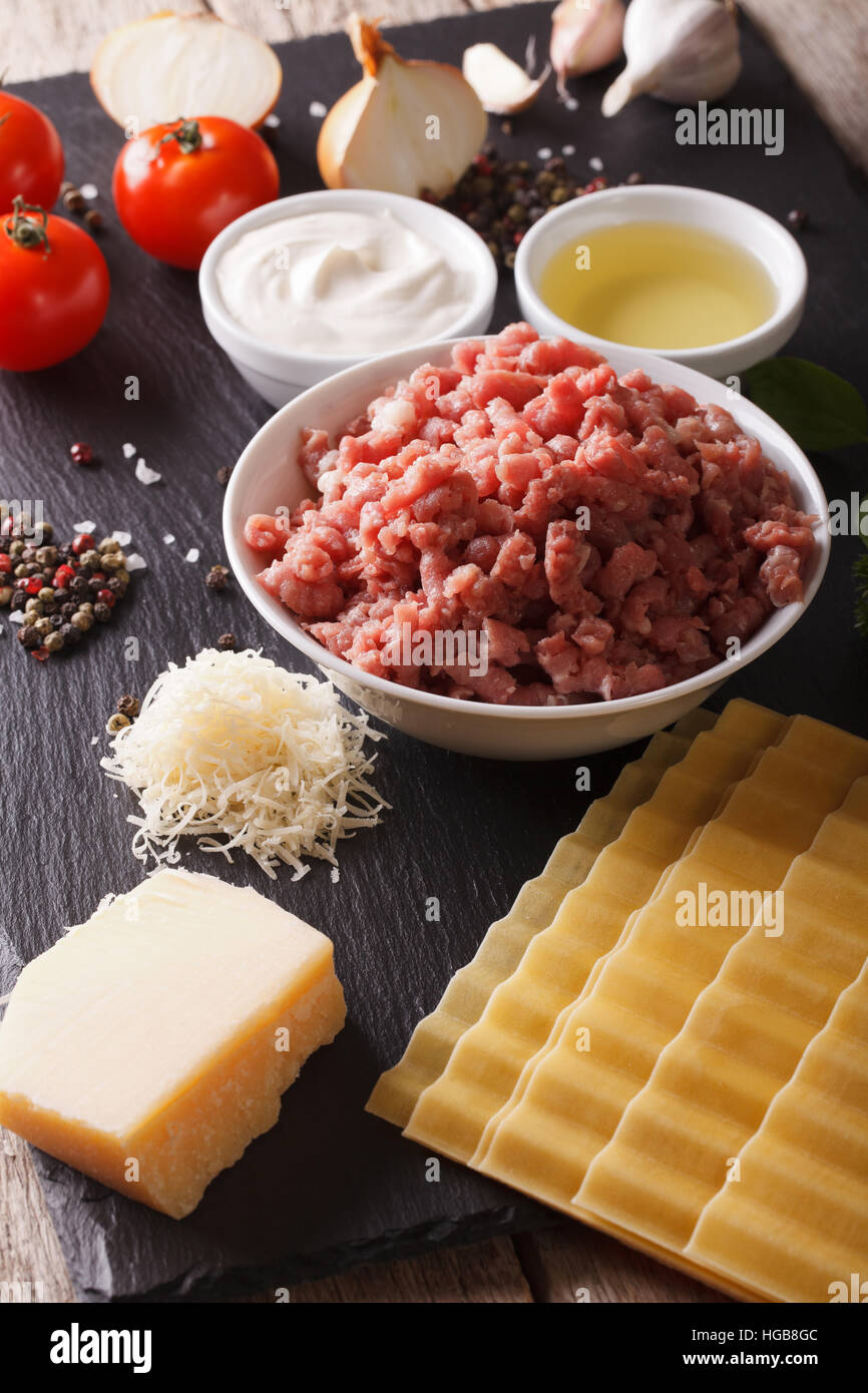 Cooking Italian lasagna on the table. Ingredients closeup. vertical ...