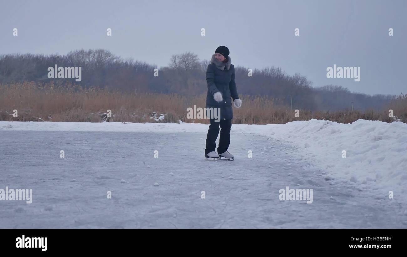 girl skating on ice, winter sport beautiful view, winter a holidays ...