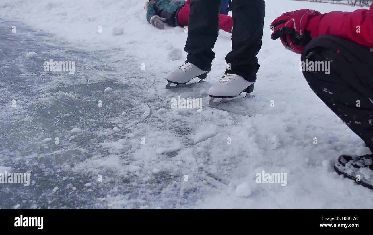 People skate on the skating sports rink in the winter on ice, a active ...