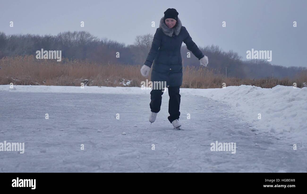 girl skating on ice, winter sport beautiful view, winter a holidays ...