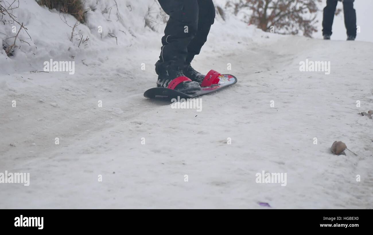 boy snowboarding in the snow with a winter holidays Stock Photo - Alamy