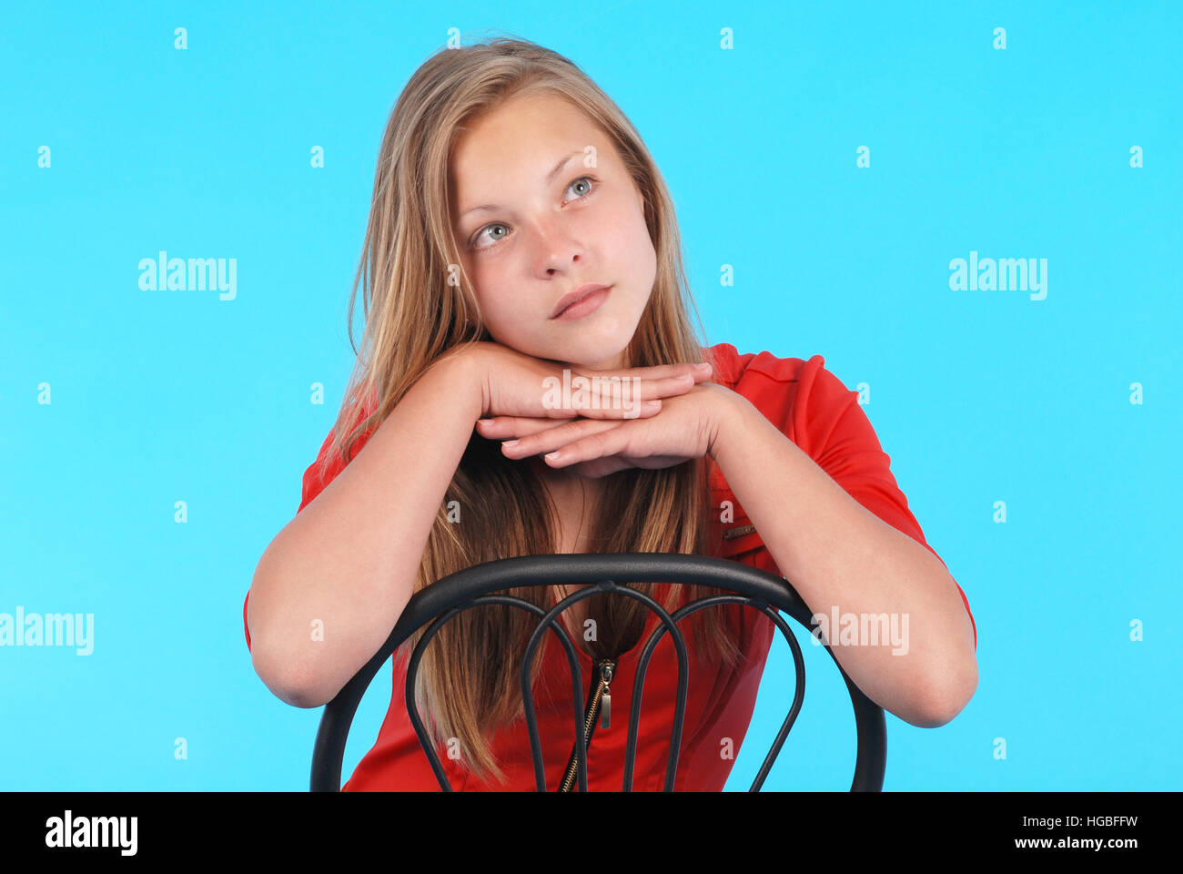 Beautiful happy smiling girl over blue background Stock Photo - Alamy