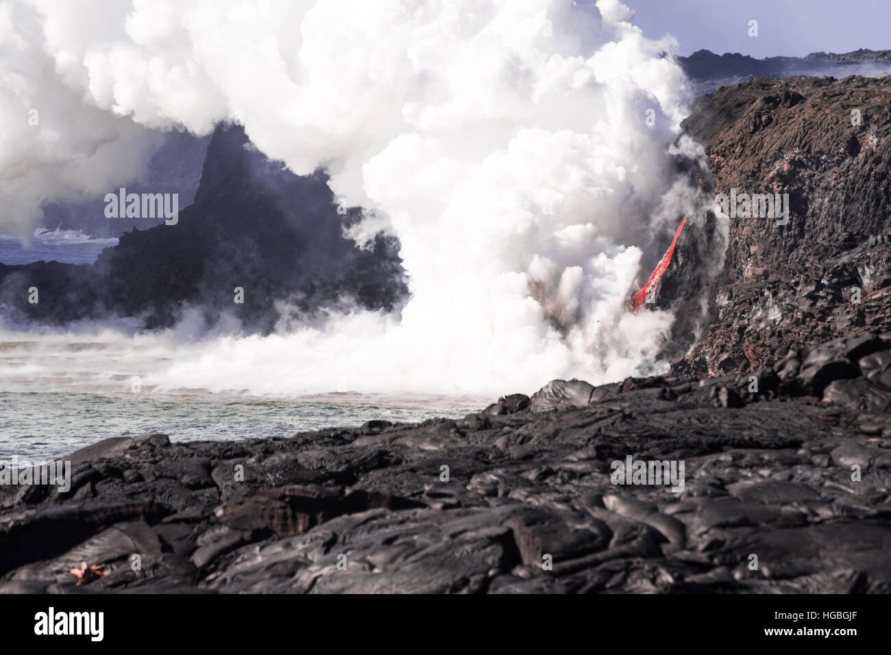 Lava flows into the ocean from Kalapana point on the Big Island of ...
