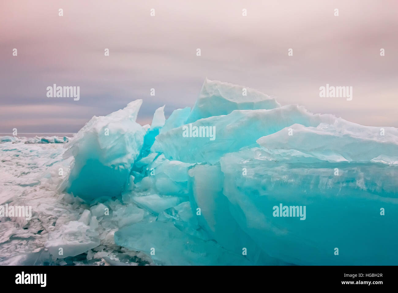 Arctic blue glacier ice hummock in cloudy weather Stock Photo - Alamy