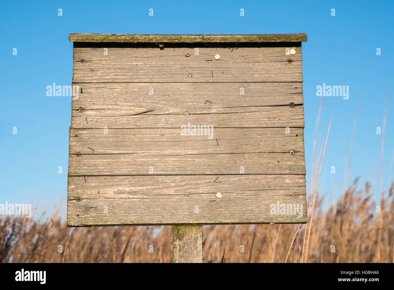 Old weathered wooden blank billboard outdoors by a blue sky Stock Photo ...