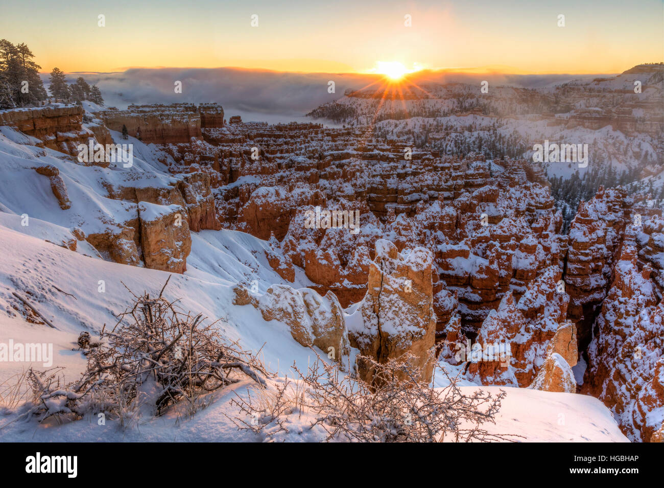 The sun rises out of the a fog bank over the Silent City of snow ...