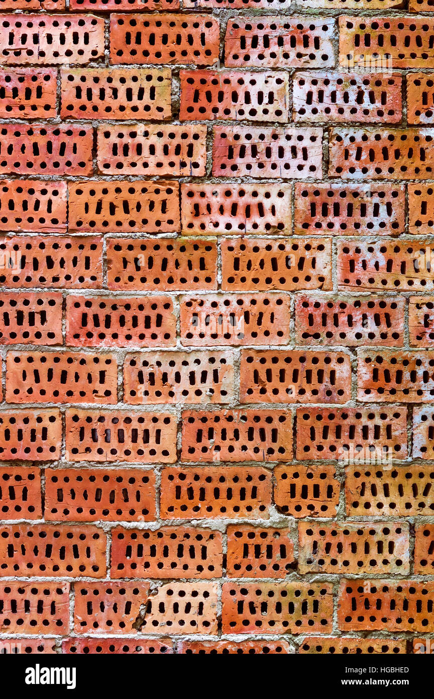 Red brick wall masonry stone works texture background Stock Photo - Alamy
