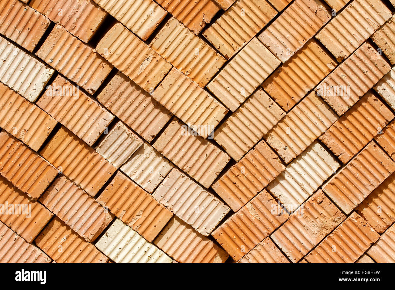 Stack of new red brick ready for building Stock Photo - Alamy
