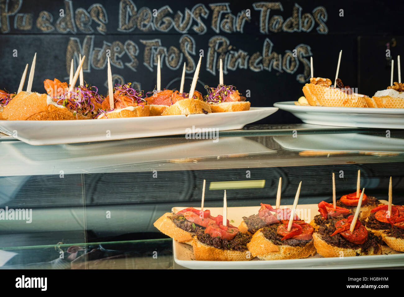 Tapas bar counter with assorted pincho tapas and a traditional ...