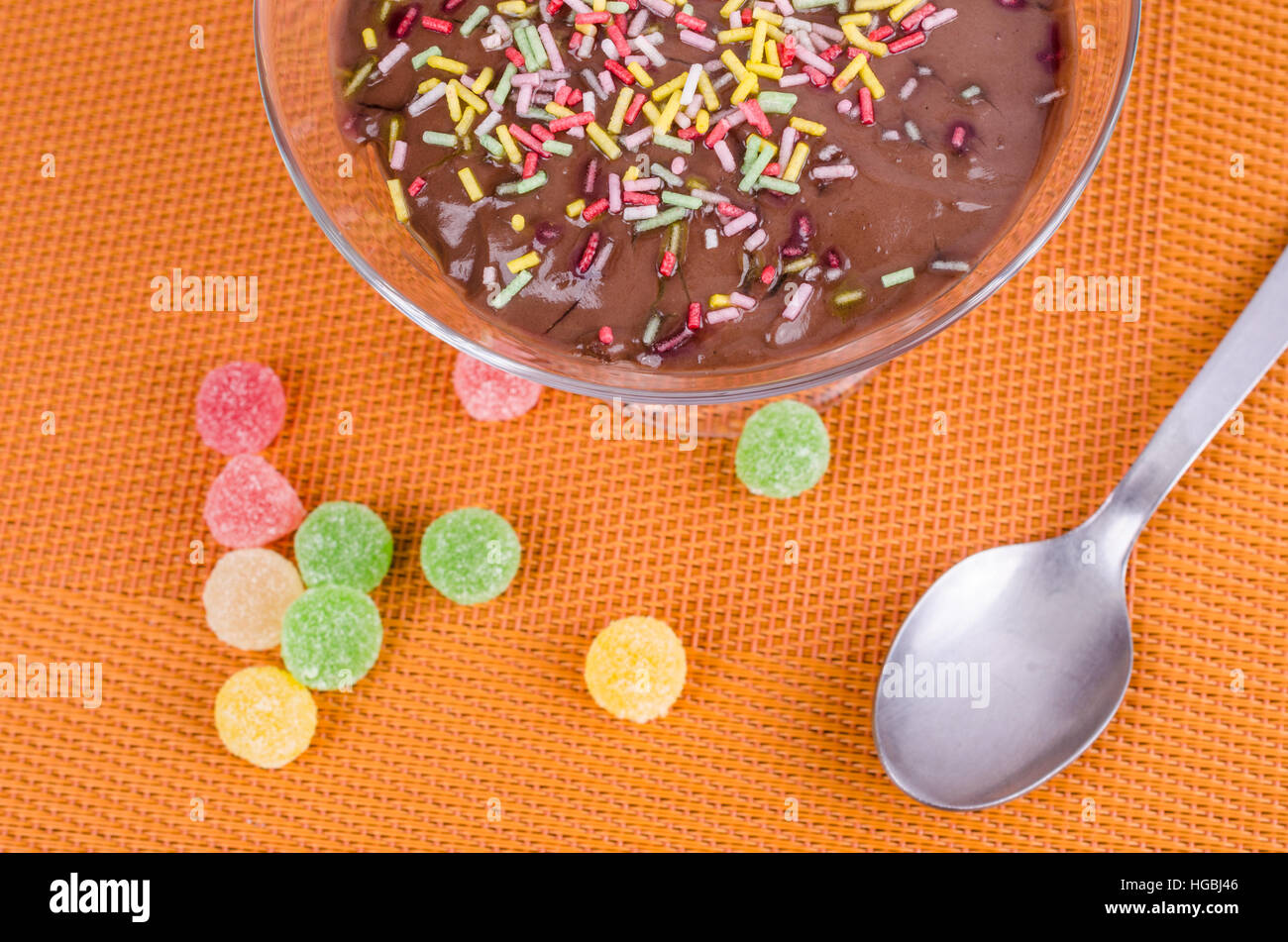Portion of chocolate pudding decorated with sugar sprinkles Stock Photo ...