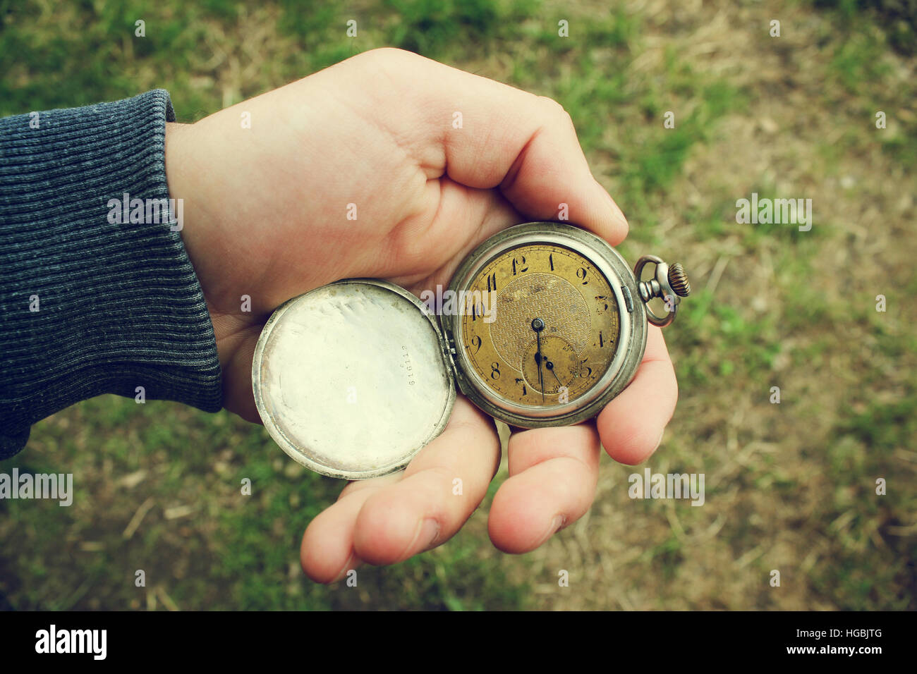 Vintage pocket watch in a man's hand Stock Photo - Alamy