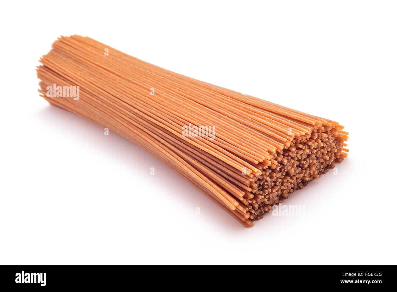 raw whole grain spaghetti pasta studio isolated Stock Photo - Alamy