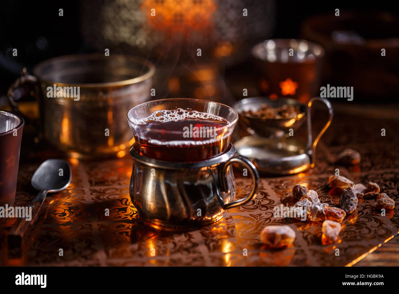 Hot tea with candle in cold winter evening Stock Photo - Alamy