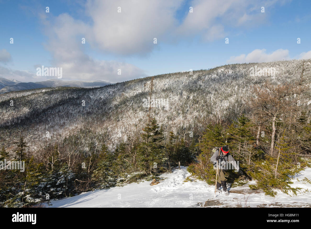 One winter hiker ascending a steep section along the Mt Parker Trail ...