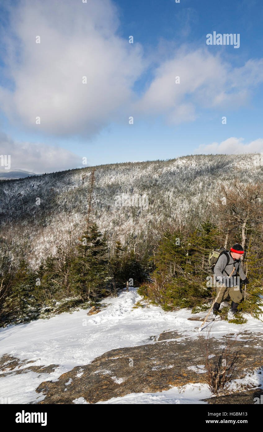 One winter hiker ascending a steep section along the Mt Parker Trail ...