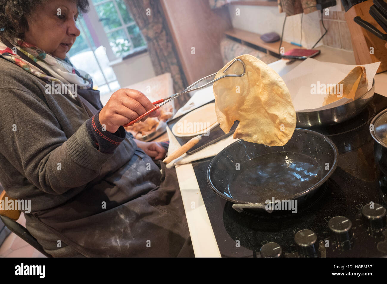 Indian woman cooking kitchen home hi-res stock photography and images ...