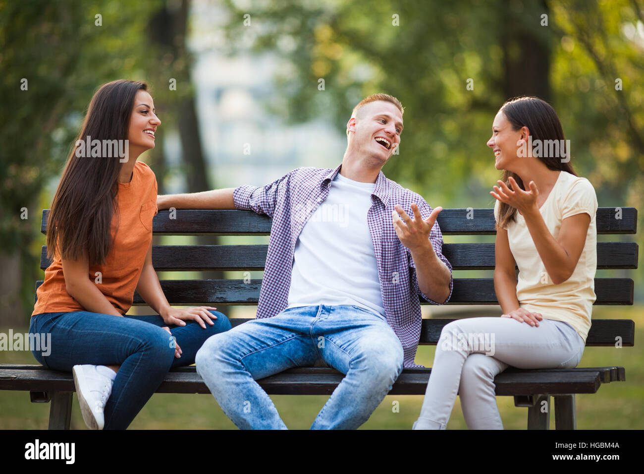 Friends in park Stock Photo - Alamy