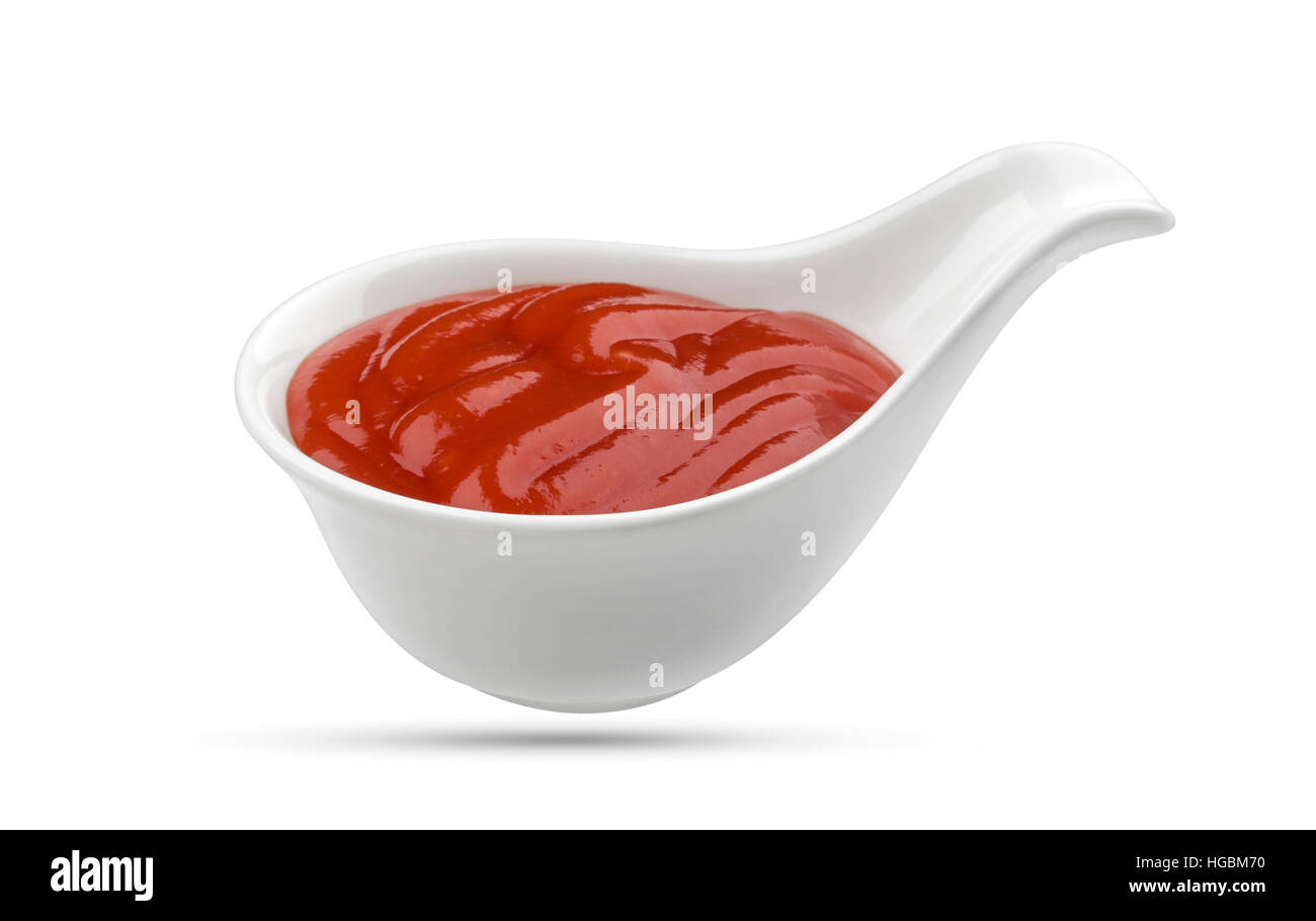 Ketchup in bowl isolated on white Stock Photo - Alamy
