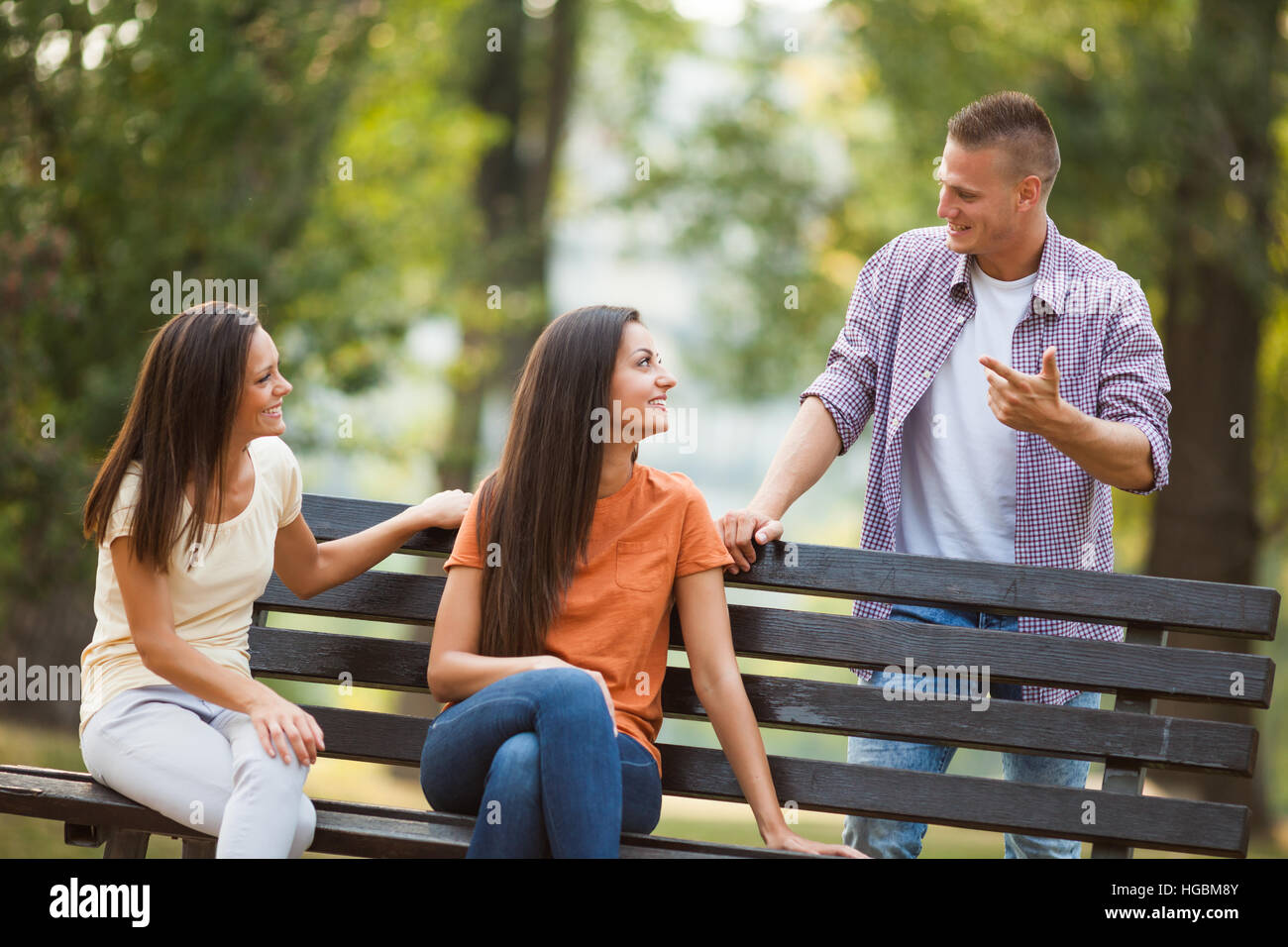 Friends in park Stock Photo - Alamy