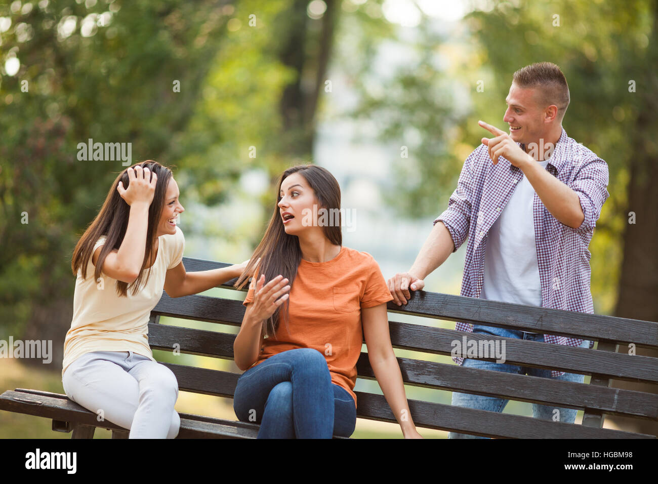Friends in park Stock Photo - Alamy