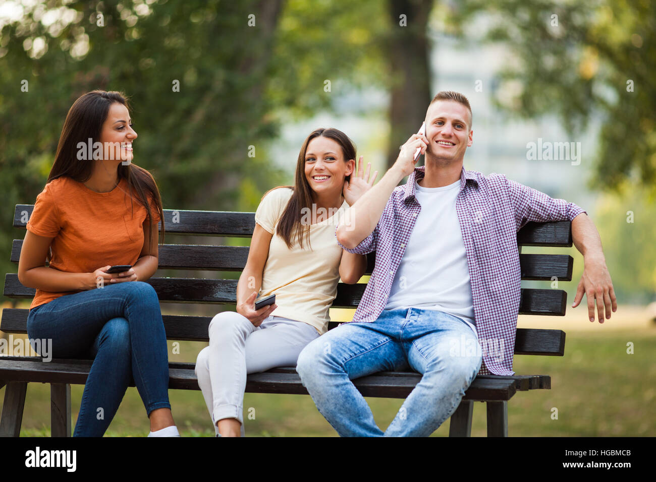 Friends in park Stock Photo - Alamy