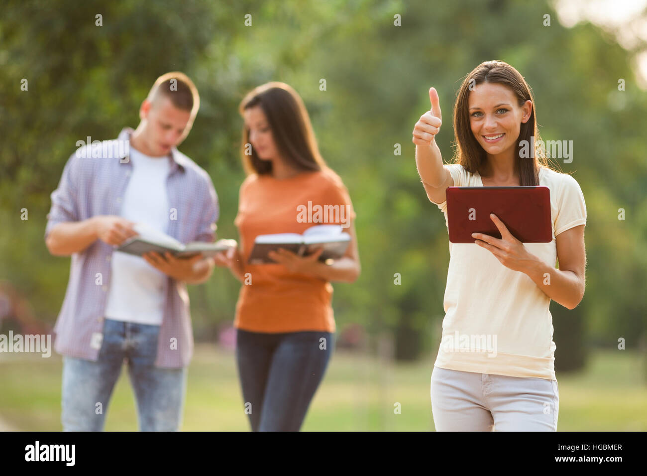 Students in park Stock Photo - Alamy
