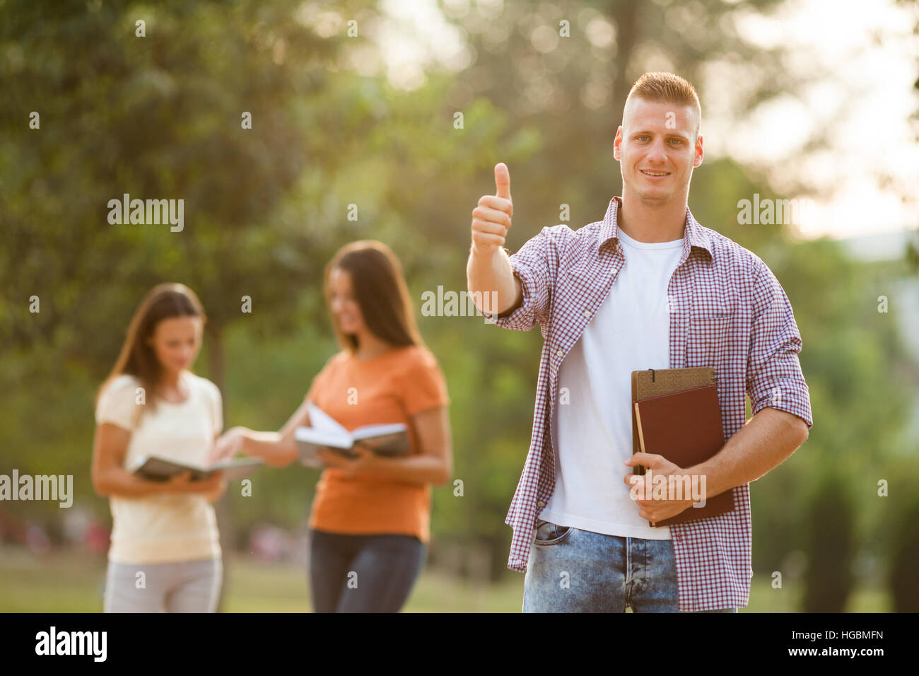 Students in park Stock Photo - Alamy