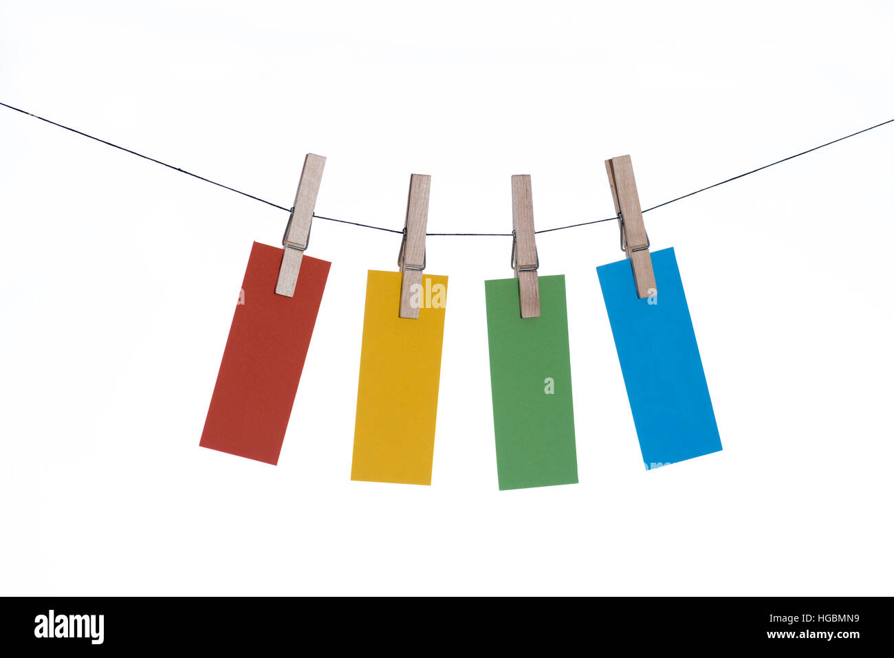 Hanging cards - four pieces of colored paper hanging from a line by ...