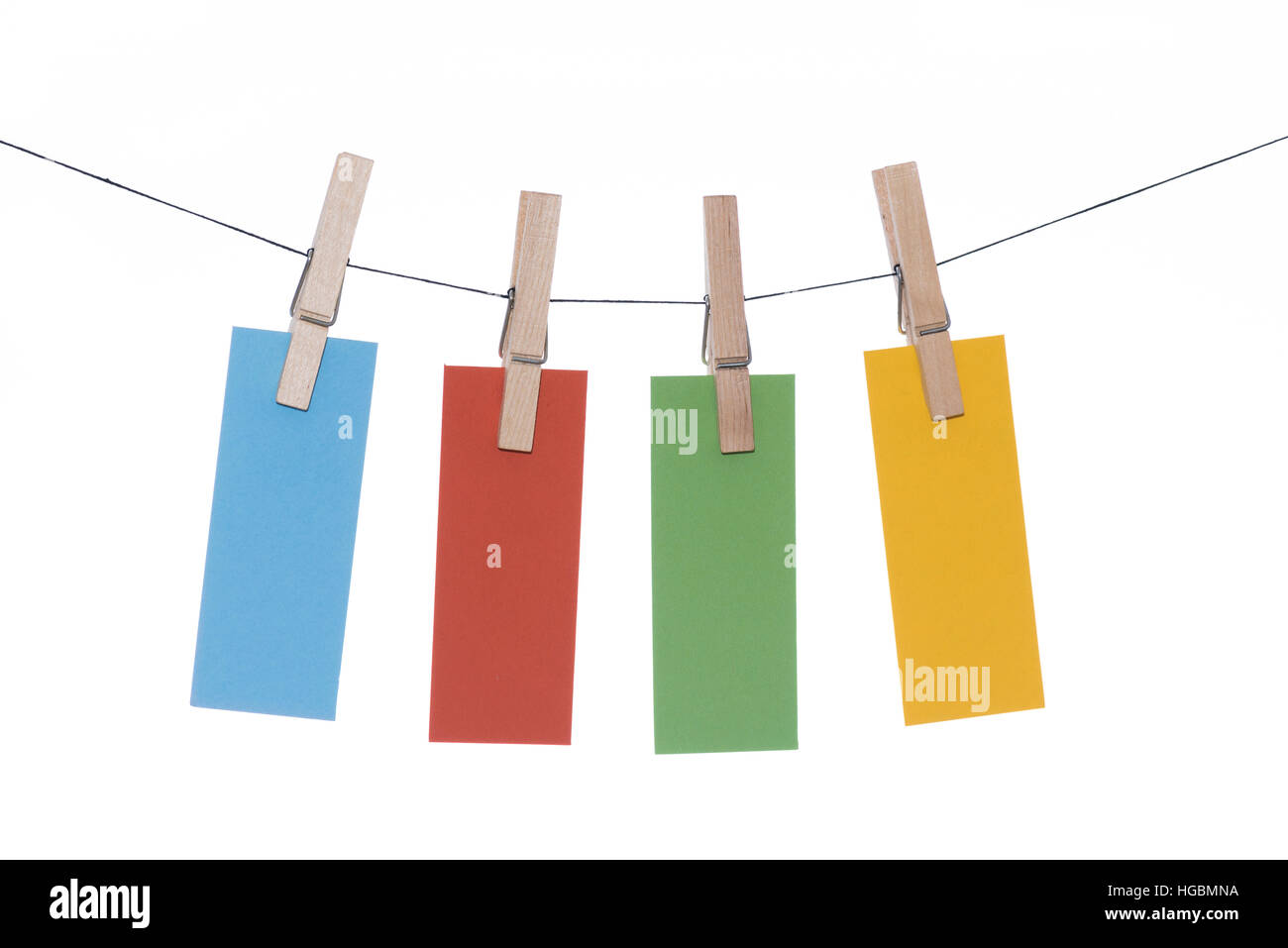 Hanging cards - four pieces of colored paper hanging from a line by ...