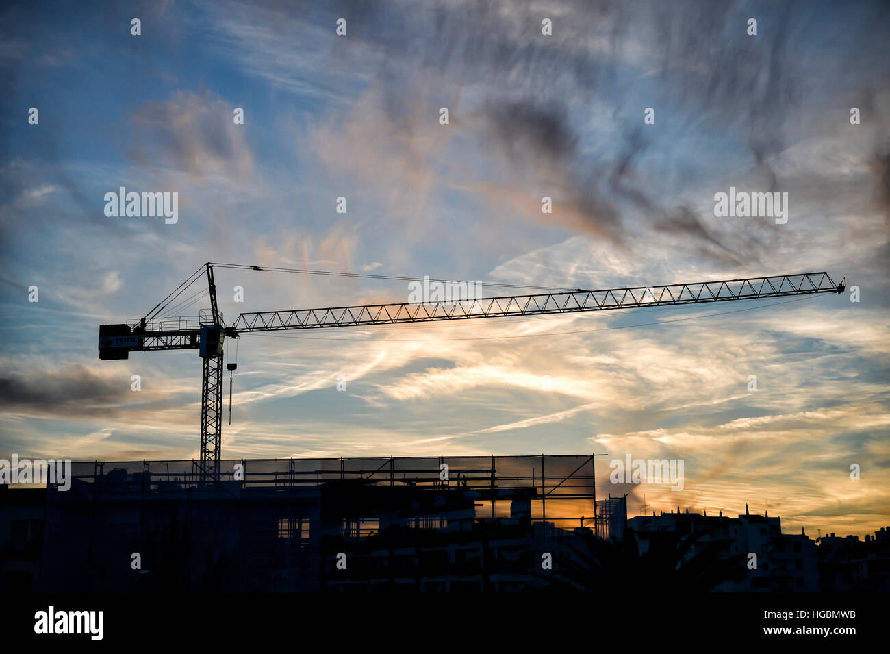 crane at sunset Stock Photo - Alamy
