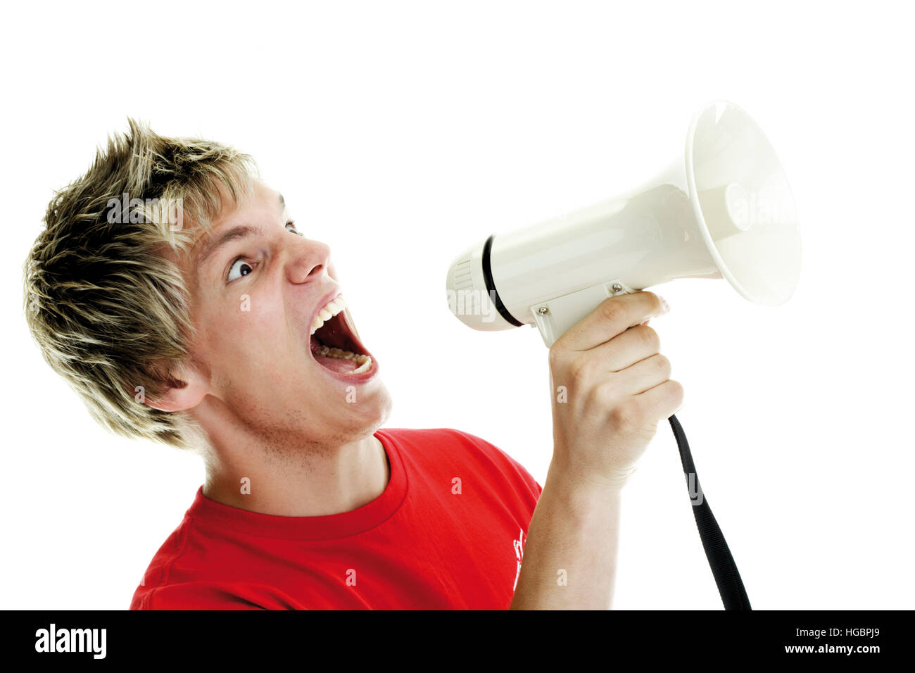 Young man screaming into a megaphone Stock Photo - Alamy