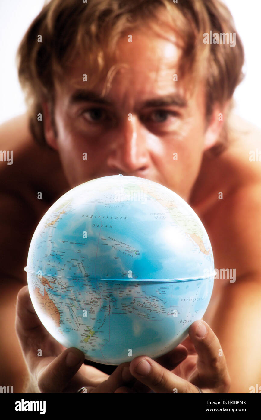 Man holding a globe Stock Photo - Alamy