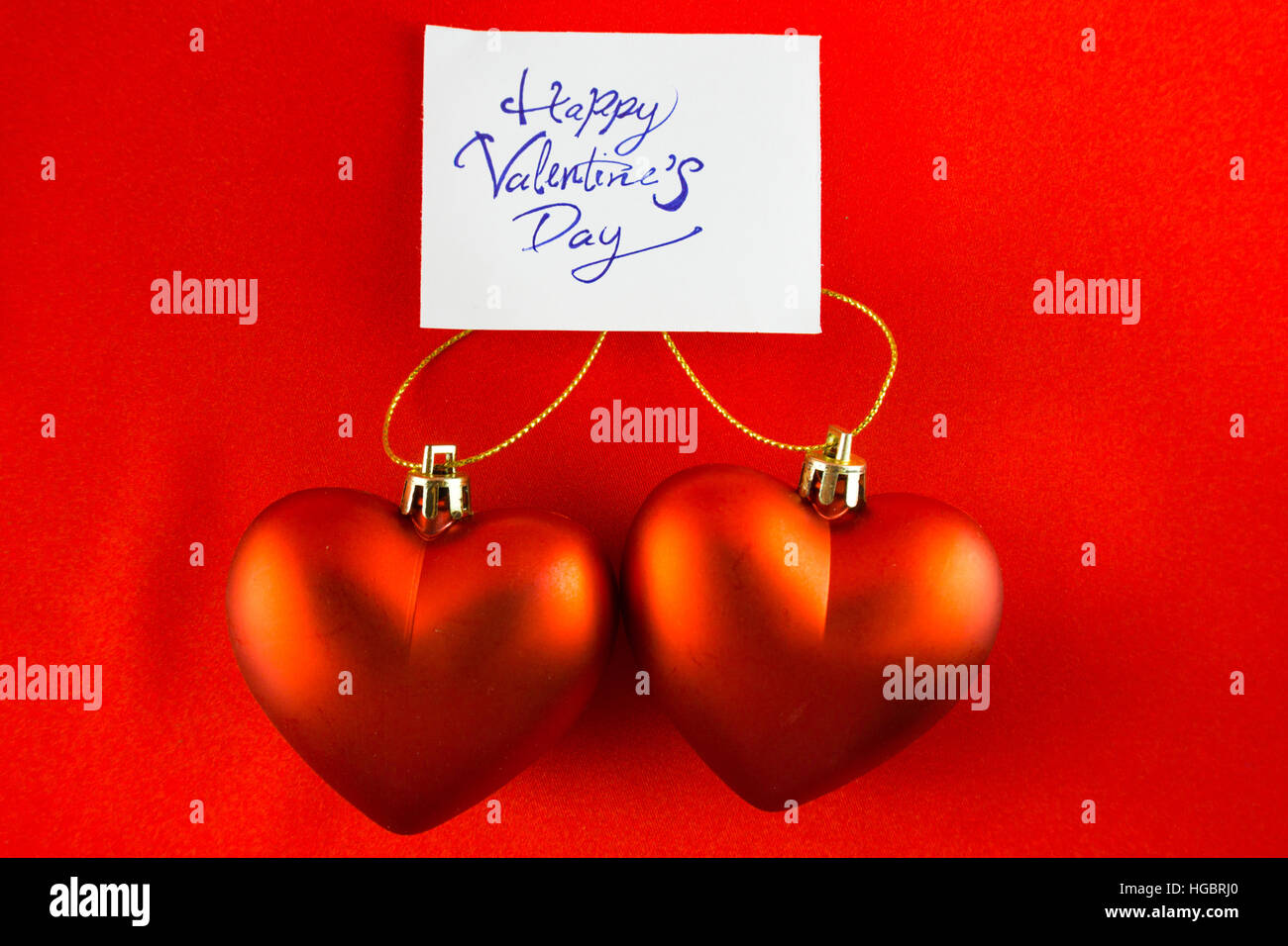 Red heart Valentines with message card on red background. Image of ...