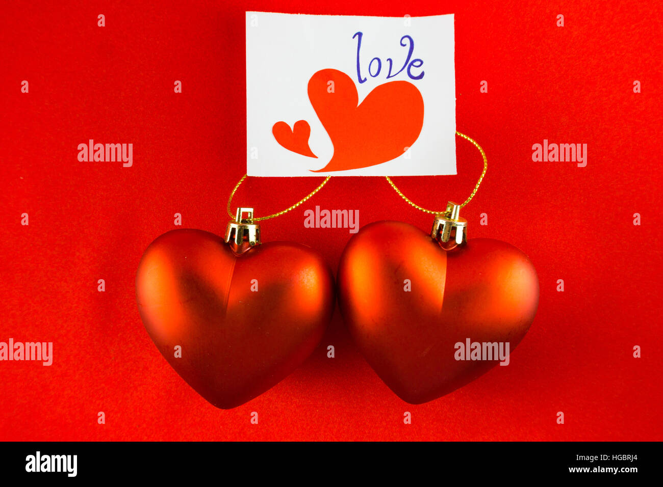 Red heart Valentines with message card on red background. Image of ...