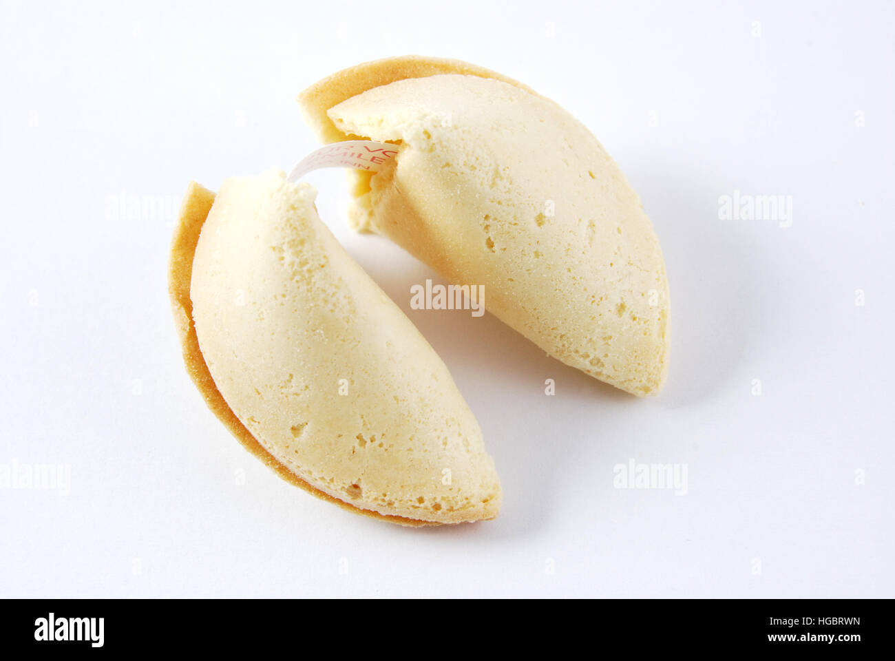 Cracked open Chinese fortune cookie on a white background Stock Photo ...