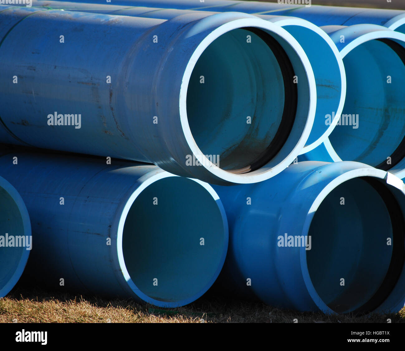 Stacked Blue Water Pipes / Tubes at a construction site Stock Photo - Alamy