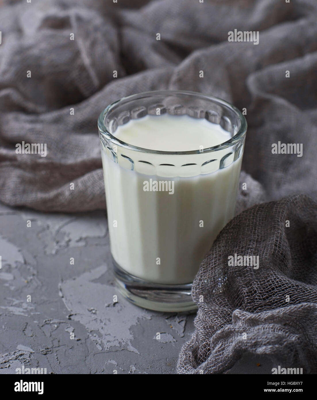 Glass of milk on gray concrete background. Selective focus Stock Photo ...