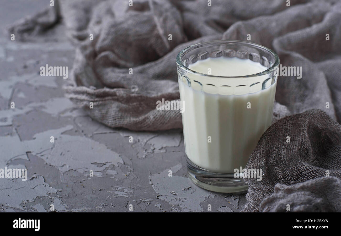 Glass of milk on gray concrete background. Selective focus Stock Photo ...