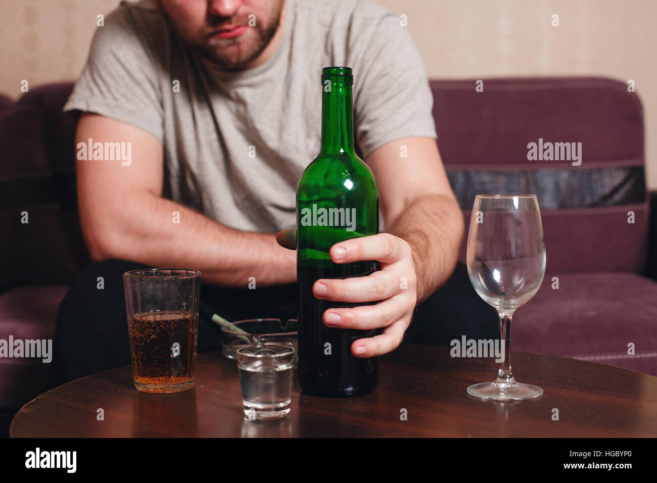 Anonymous alcoholic person hard drinking Stock Photo - Alamy