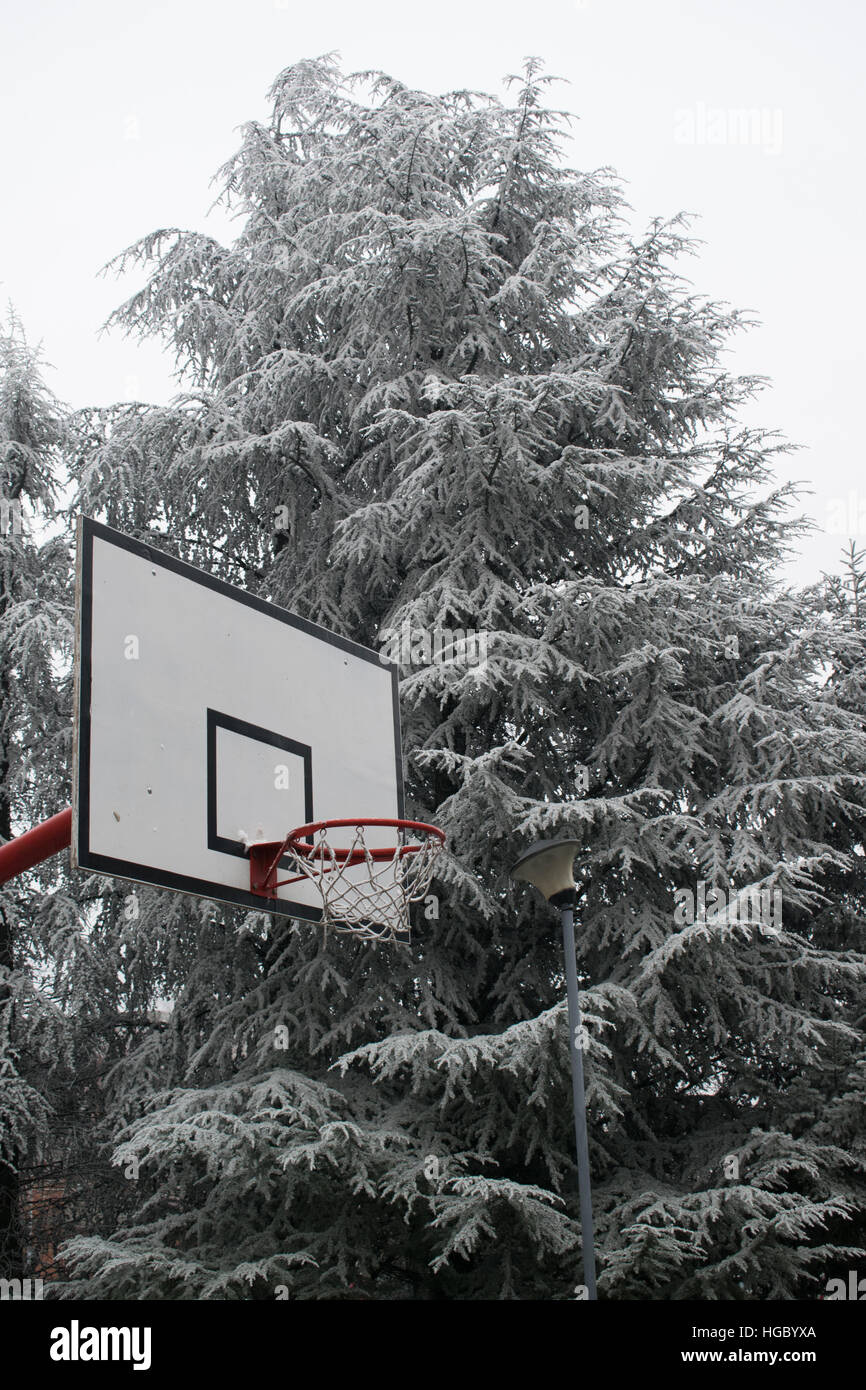 Outdoor basketball court on the cold winter day with snow and ice Stock ...