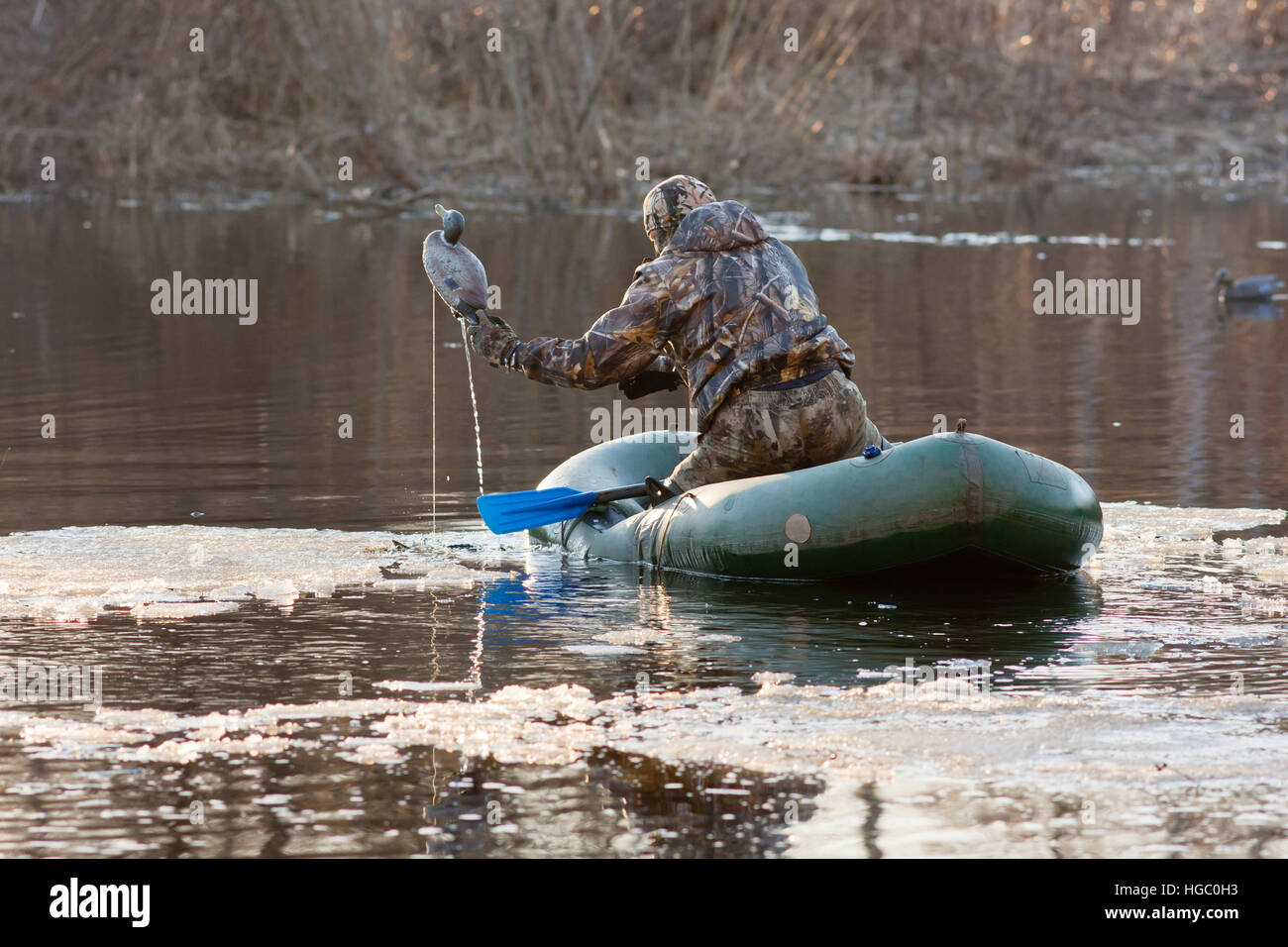 hunter on the boat with stuffed ducks Stock Photo - Alamy