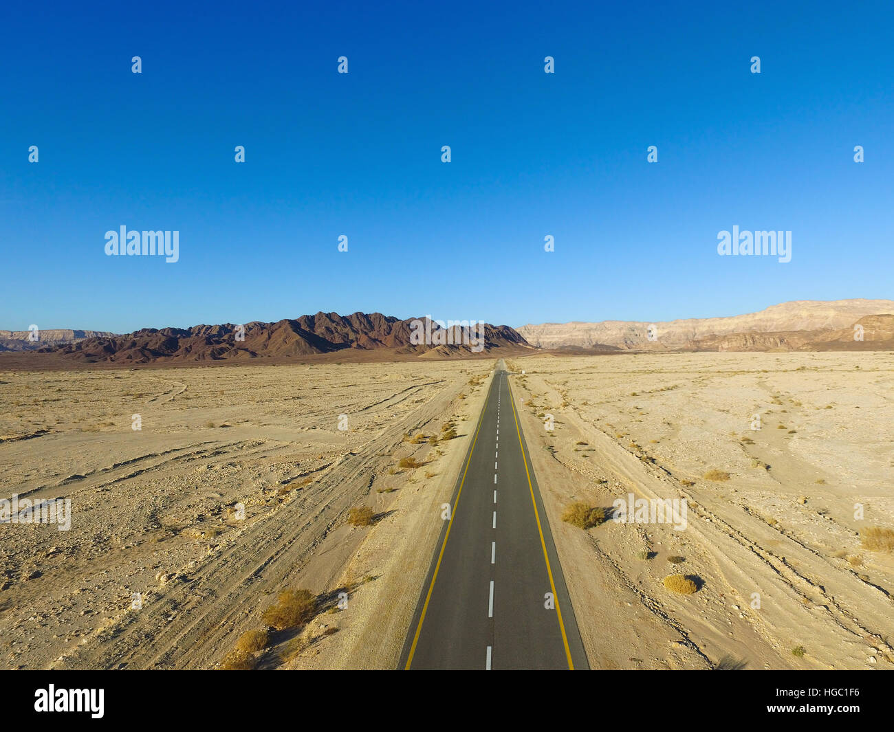 Empty desert road - Aerial image Stock Photo - Alamy