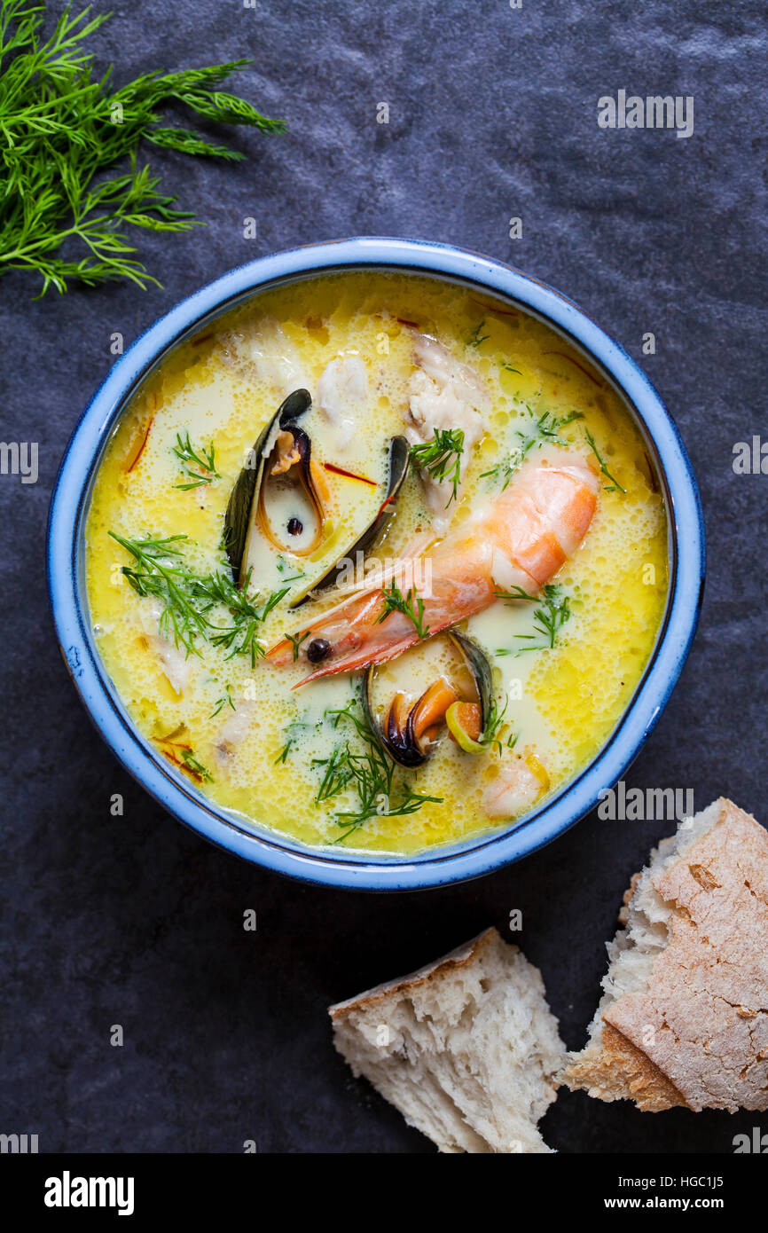 Scandinavian creamy fish soup with halibut, prawns and mussels Stock ...
