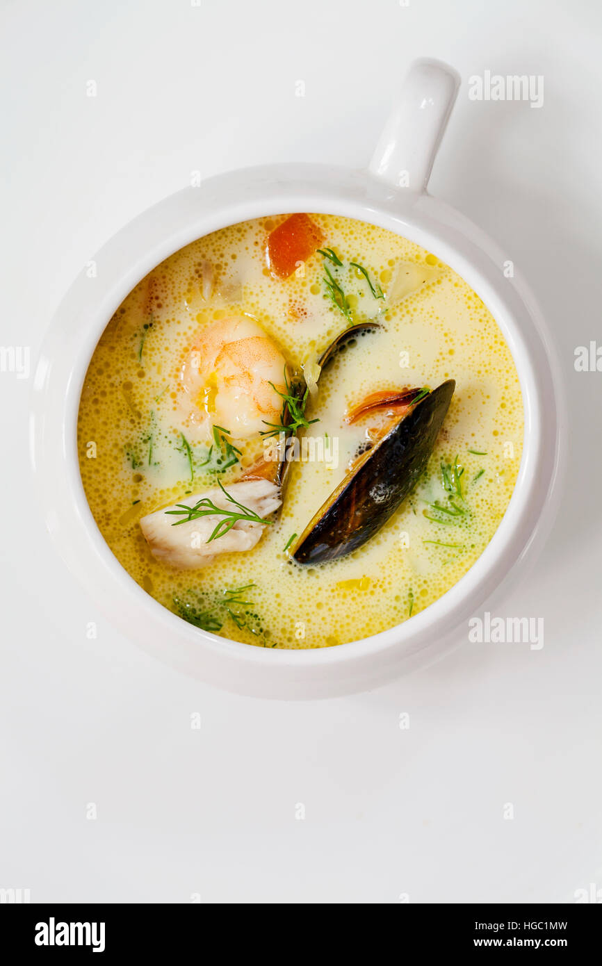 Scandinavian creamy fish soup with halibut, prawns and mussels Stock ...