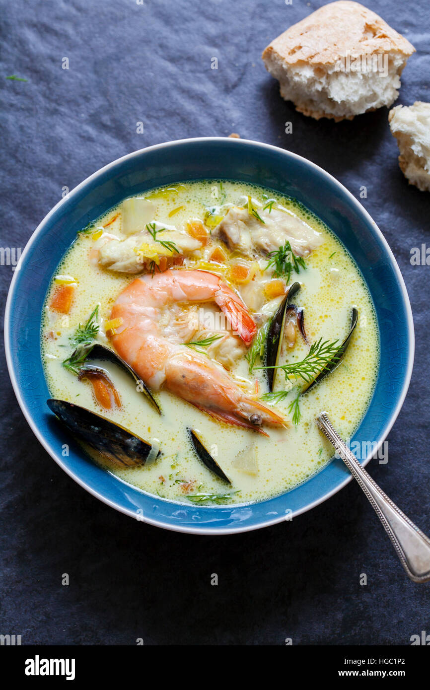 Scandinavian creamy fish soup with halibut, prawns and mussels Stock ...