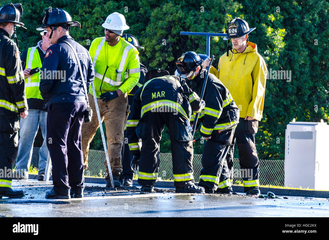 A fire hydrant broken off by a truck creates a geyser and small flood ...